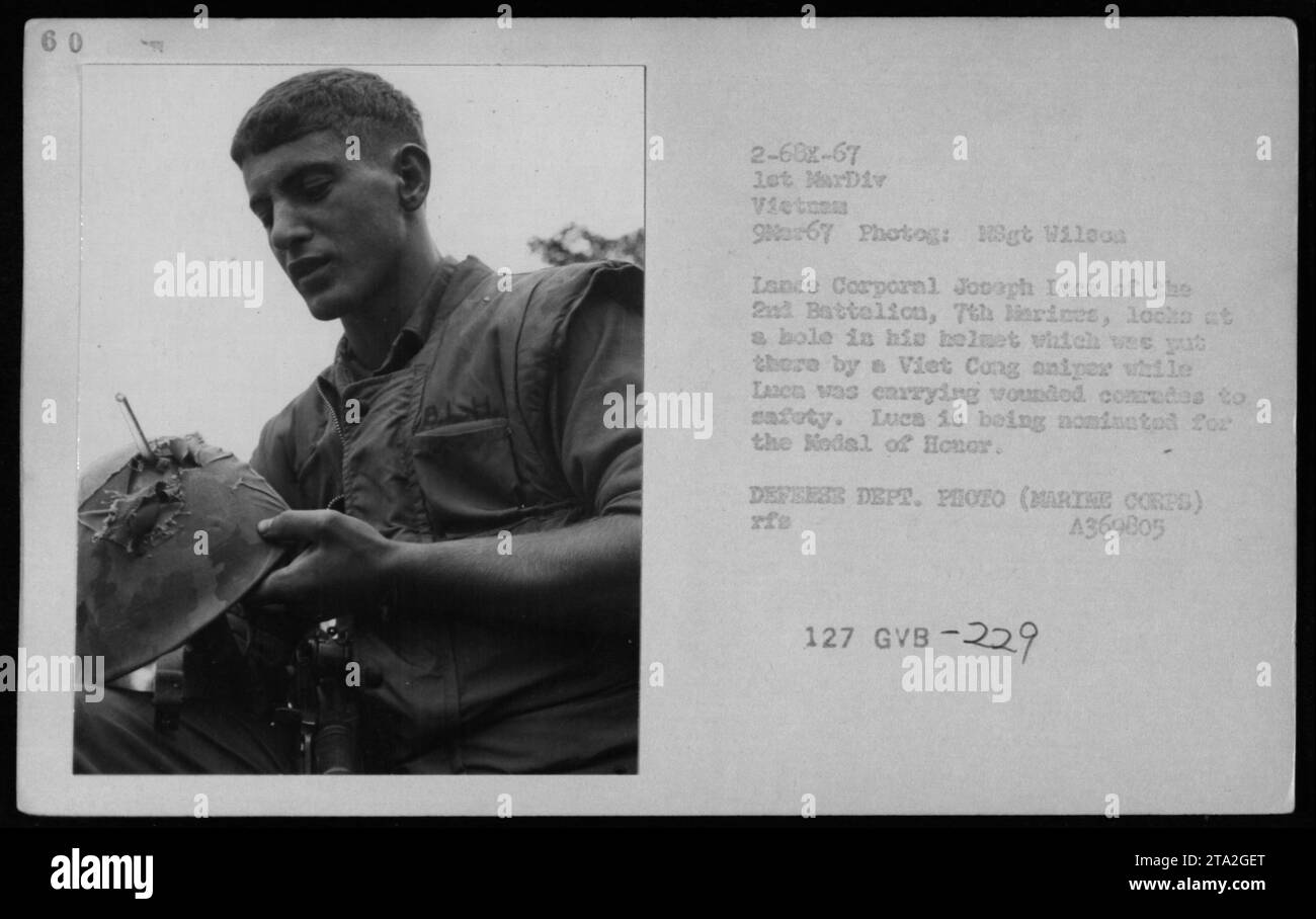 Lance Corporal Joseph Lucas of the 2nd Battalion, 7th Marines inspects ...