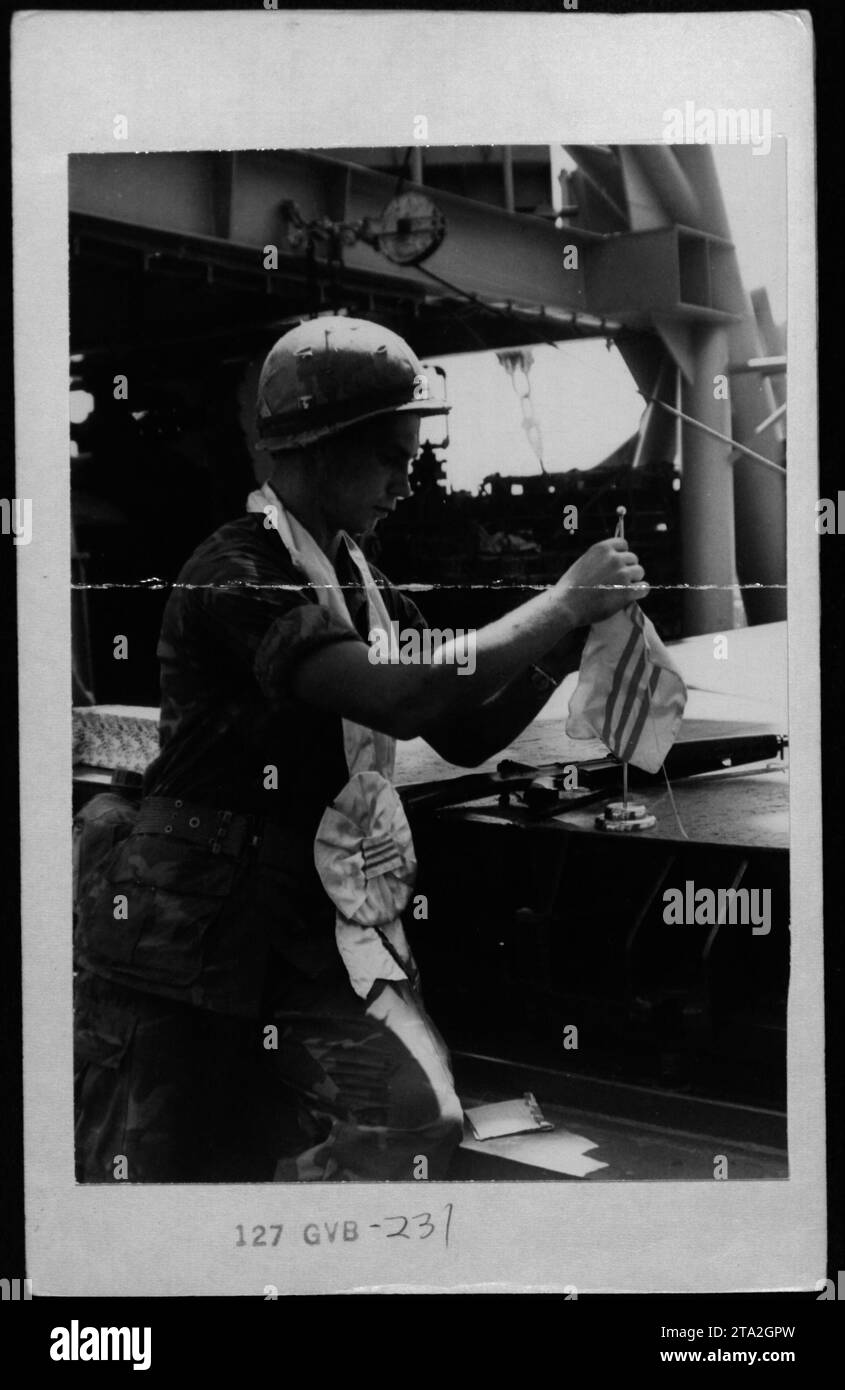 American soldiers patrol muddy rural terrain in Vietnam during military ...