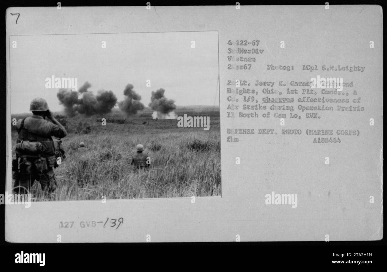 2nd Lt. Jerry E. Carney of A Co. 169 examines the impact of an air ...