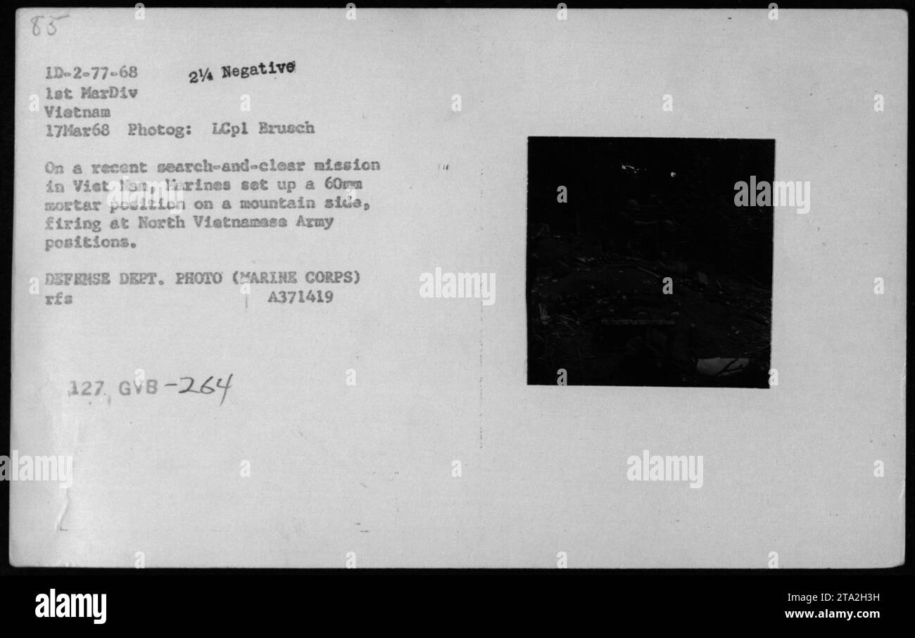 On March 17, 1968, Marines set up a 60mm mortar on a mountainside and ...