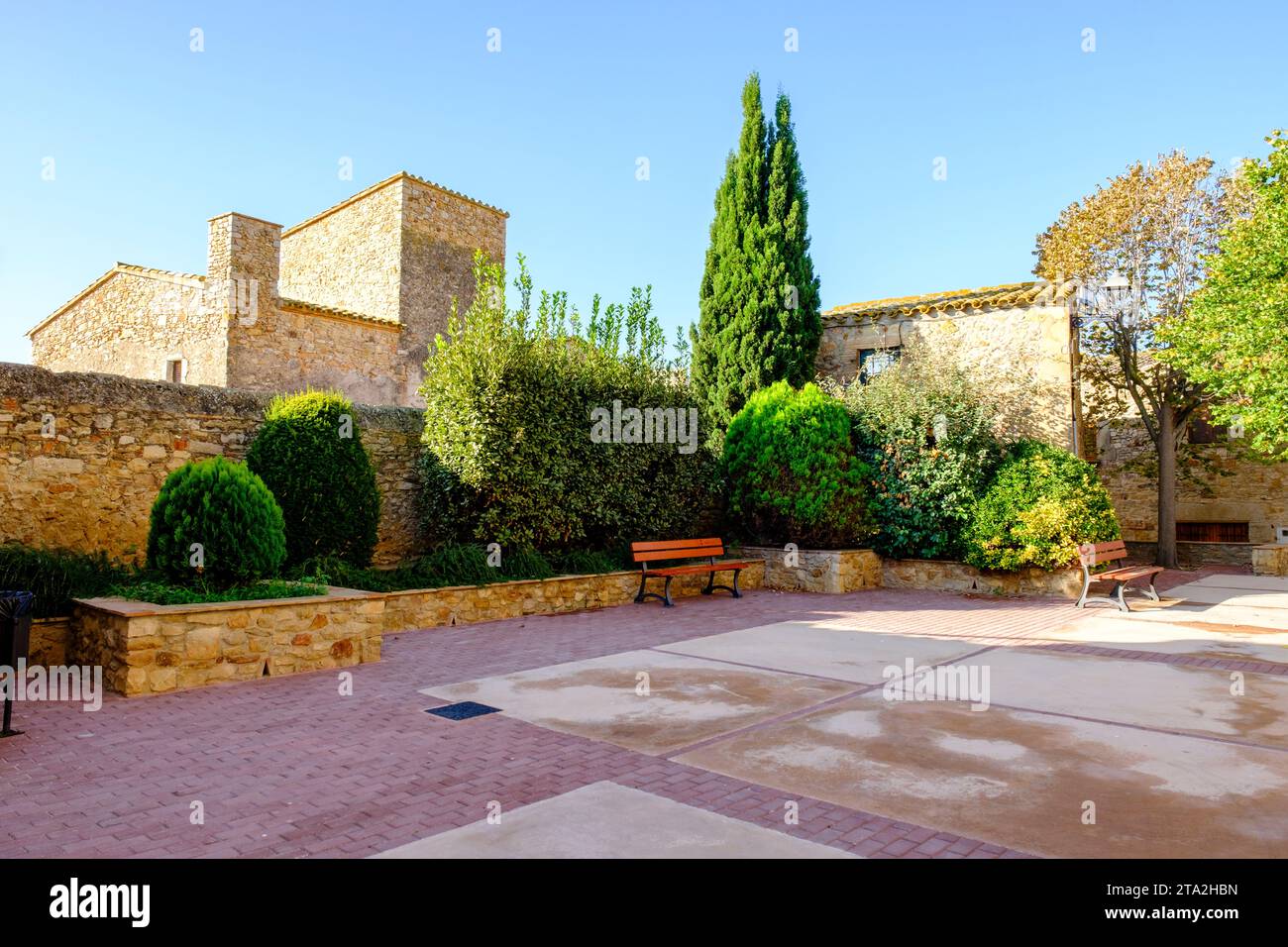 Empty public plaza, medieval town of Regencós, Baix Empordà, Lower ...