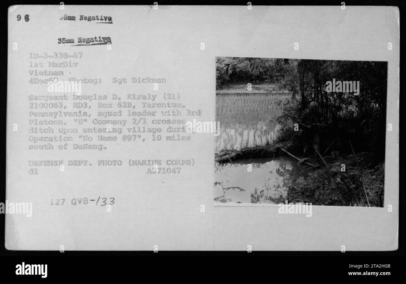 Sergeant Douglas D. Kiraly, squad leader of E Company 2/3, crosses a ...
