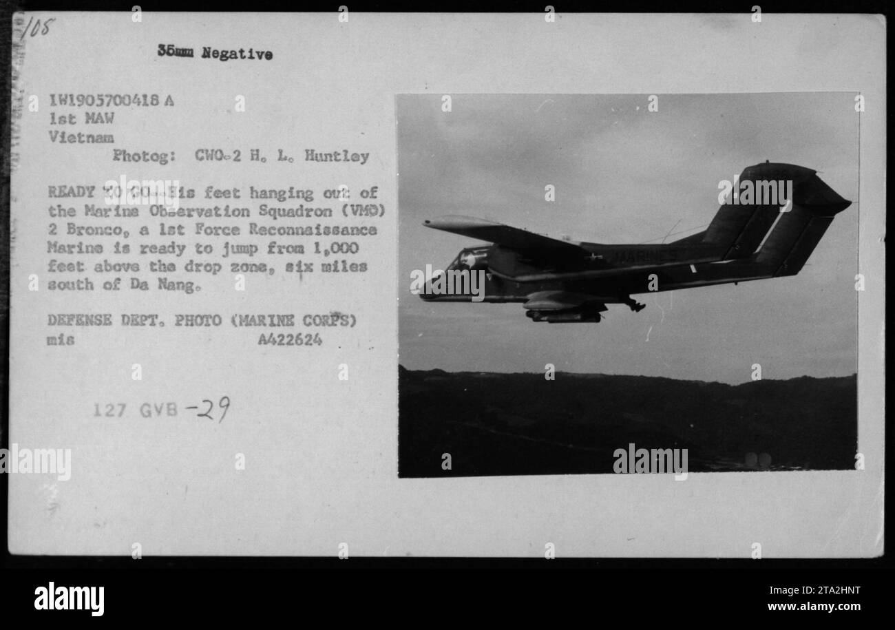 A Marine from 1st Force Reconnaissance prepares to jump from a Marine ...