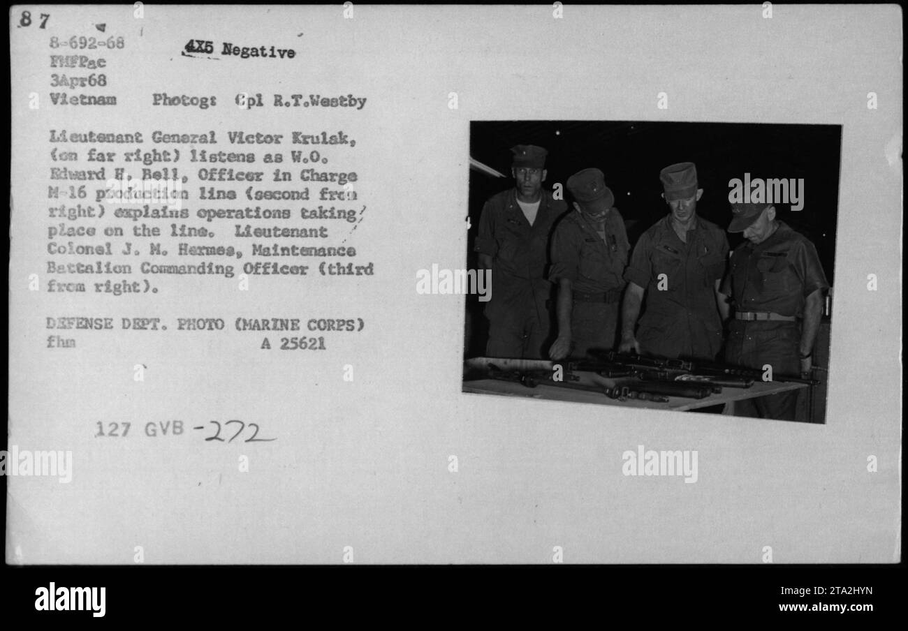 Lieutenant General Victor Krulak listens to W.O. Edward H. Bell ...