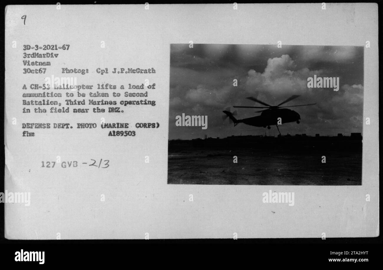 A CH-53 helicopter in Vietnam's 3rd Marine Division lifts a load of ...