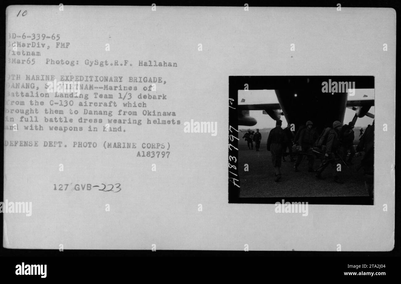 Marines of Battalion Landing Team 1/3 disembark from a C-130 aircraft ...