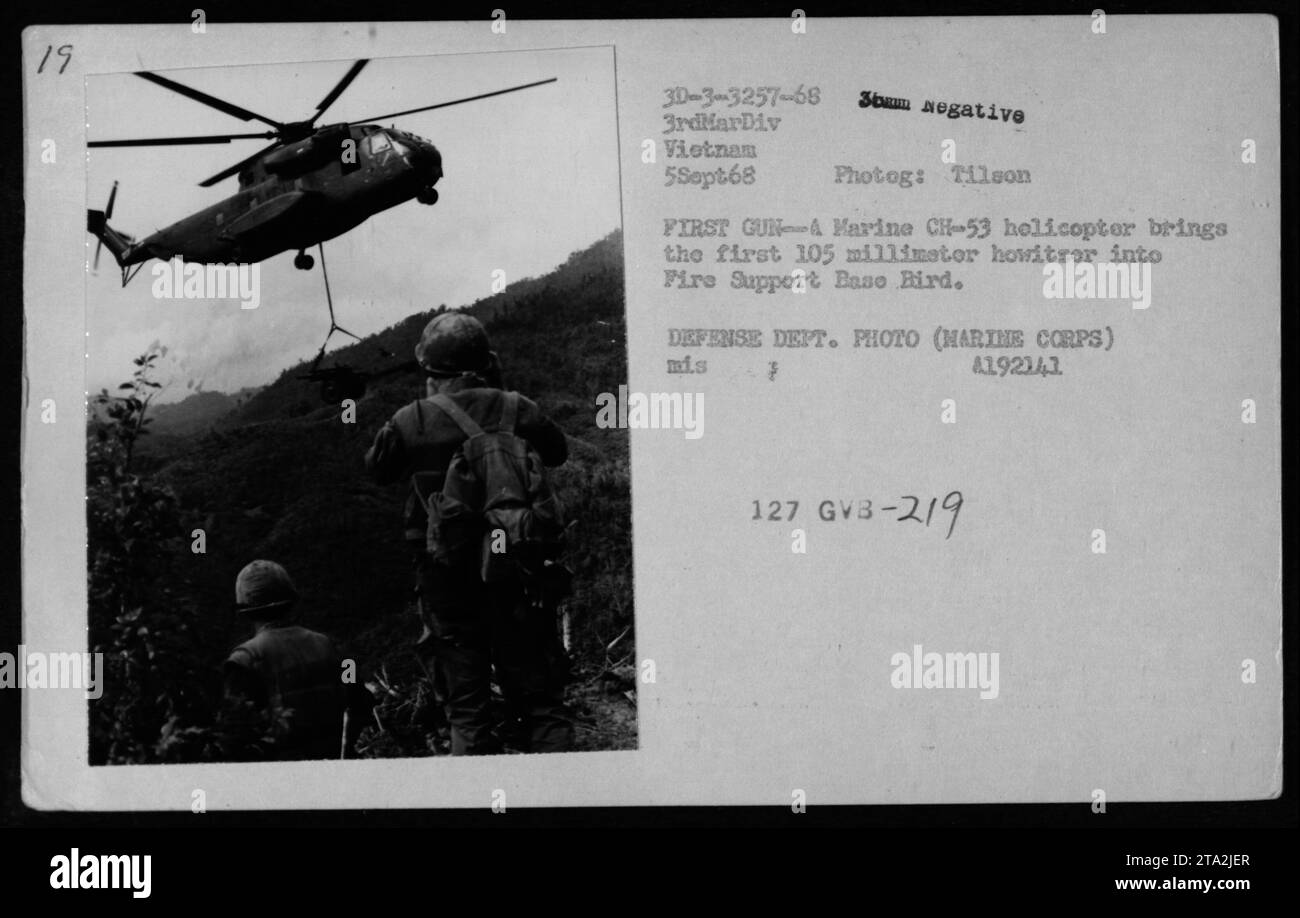 On September 5, 1968, a CH-53 helicopter transports a 105mm howitzer ...