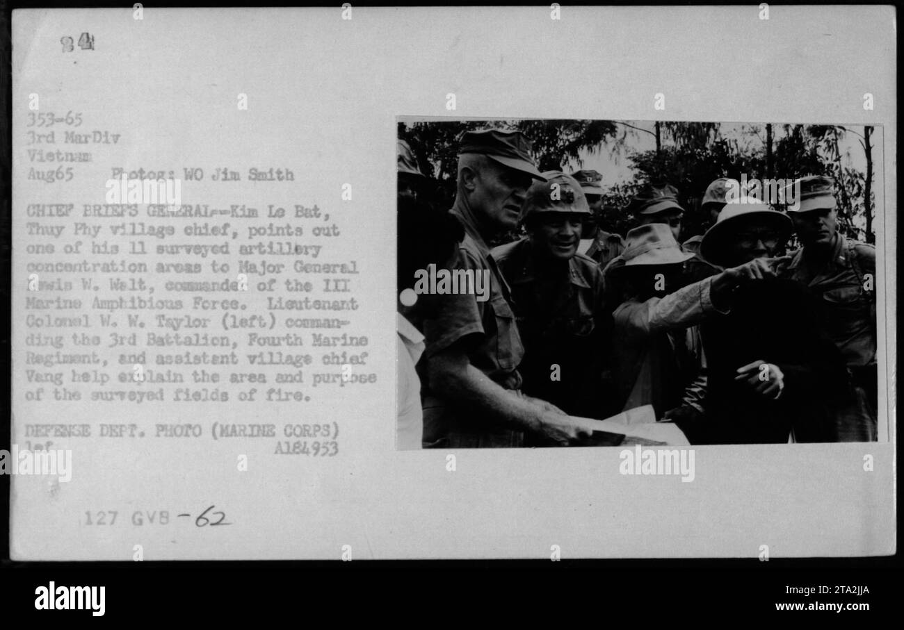 General Kim Lo Bat, the Thuy Phy village chief, shows one of his 11 ...