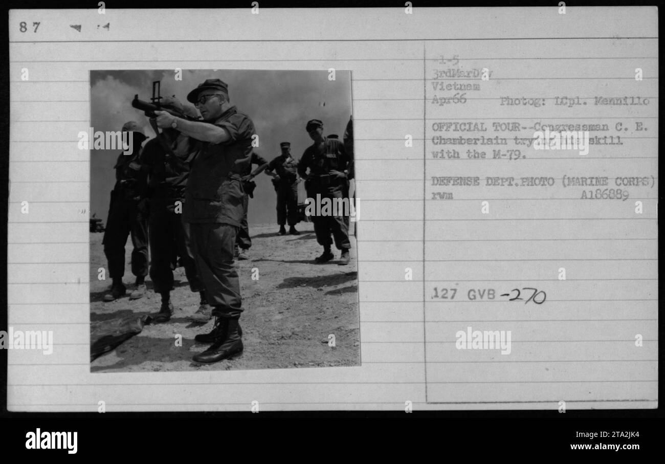 The photograph shows Congressman C. E. Chamberlain testing his ...