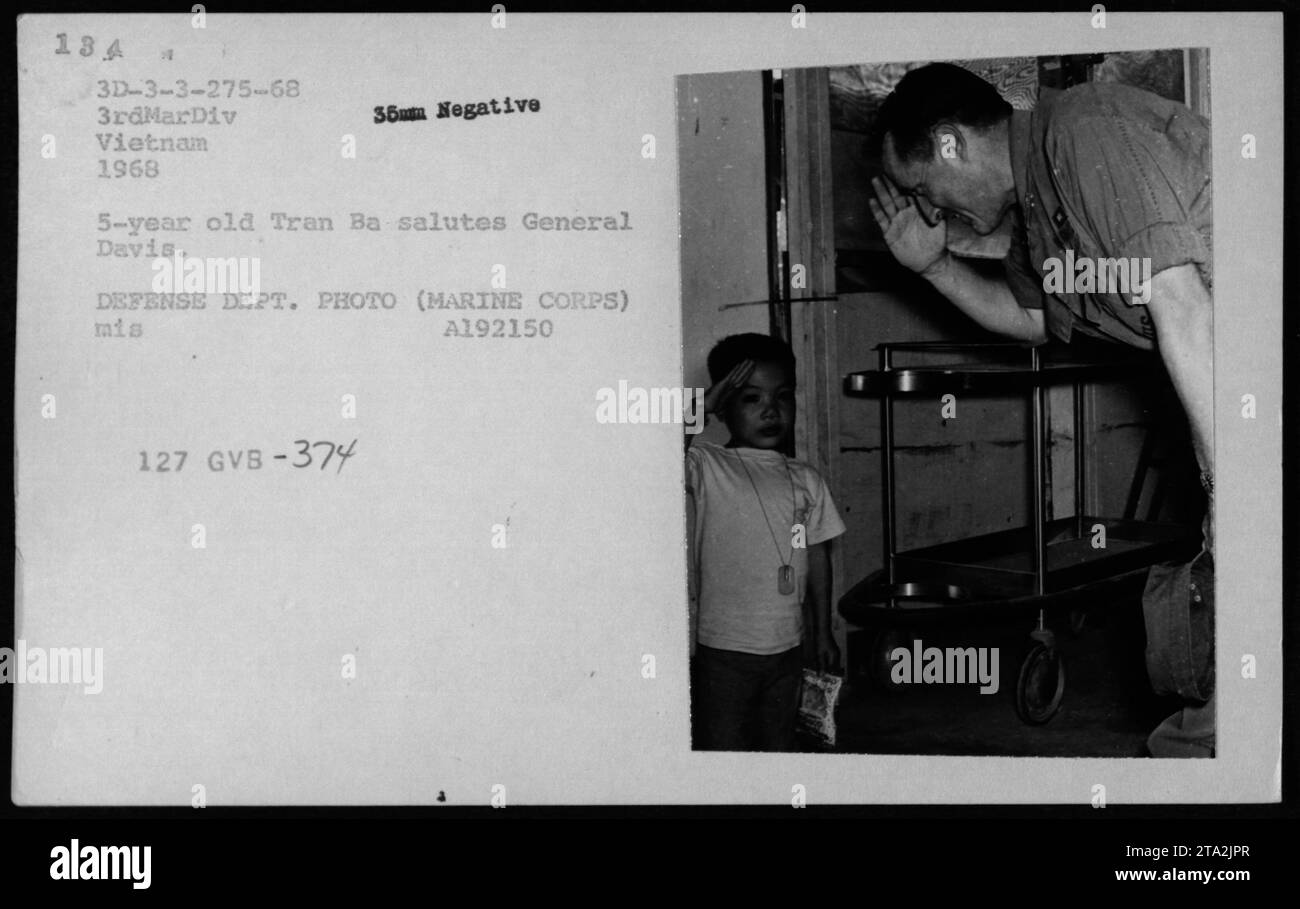 Tran Ba, a 5-year-old Vietnamese boy, salutes General Davis in 1968 ...