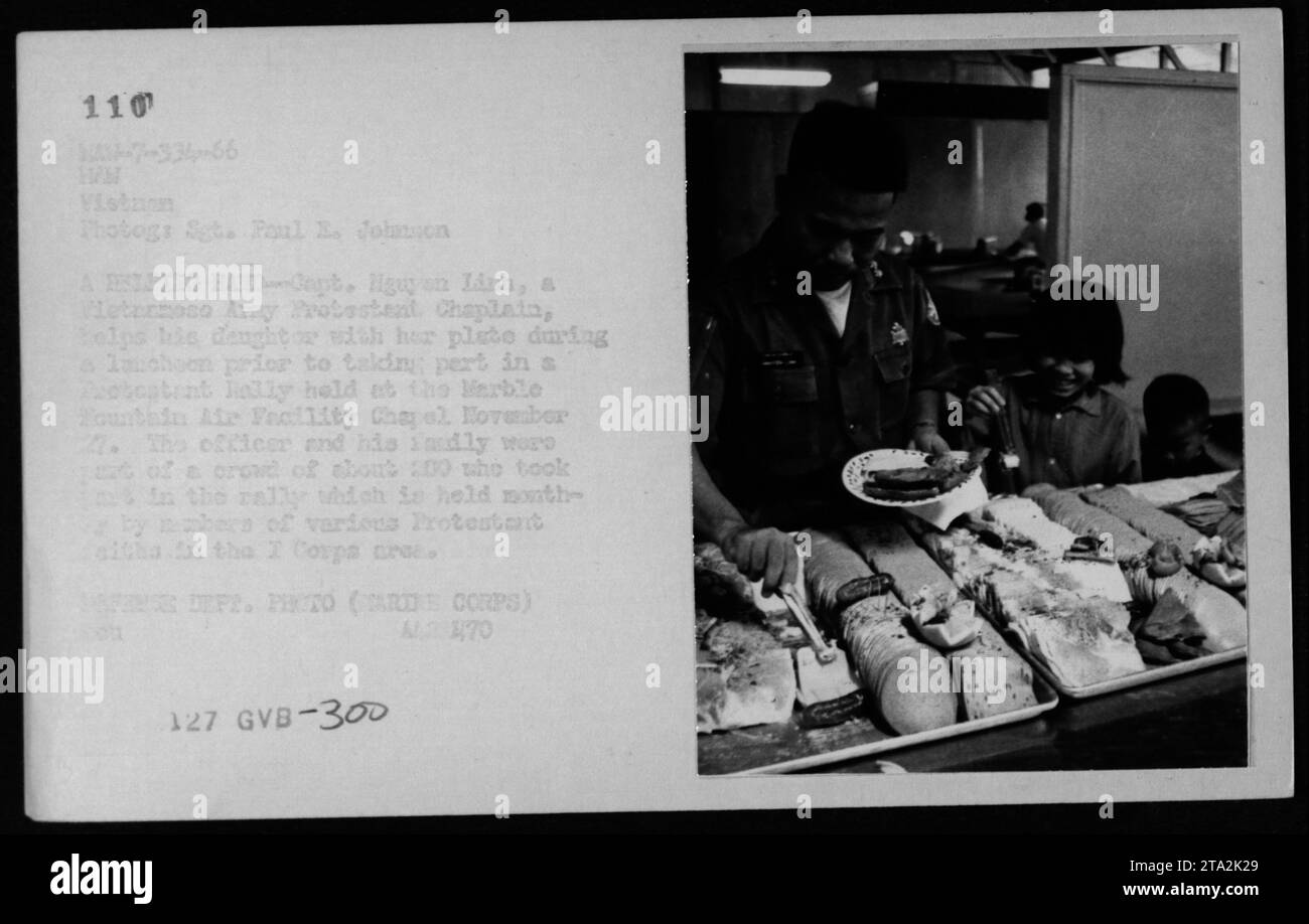 Captain Nguyen LanH, a Protestant Chaplain, helping his daughter with ...