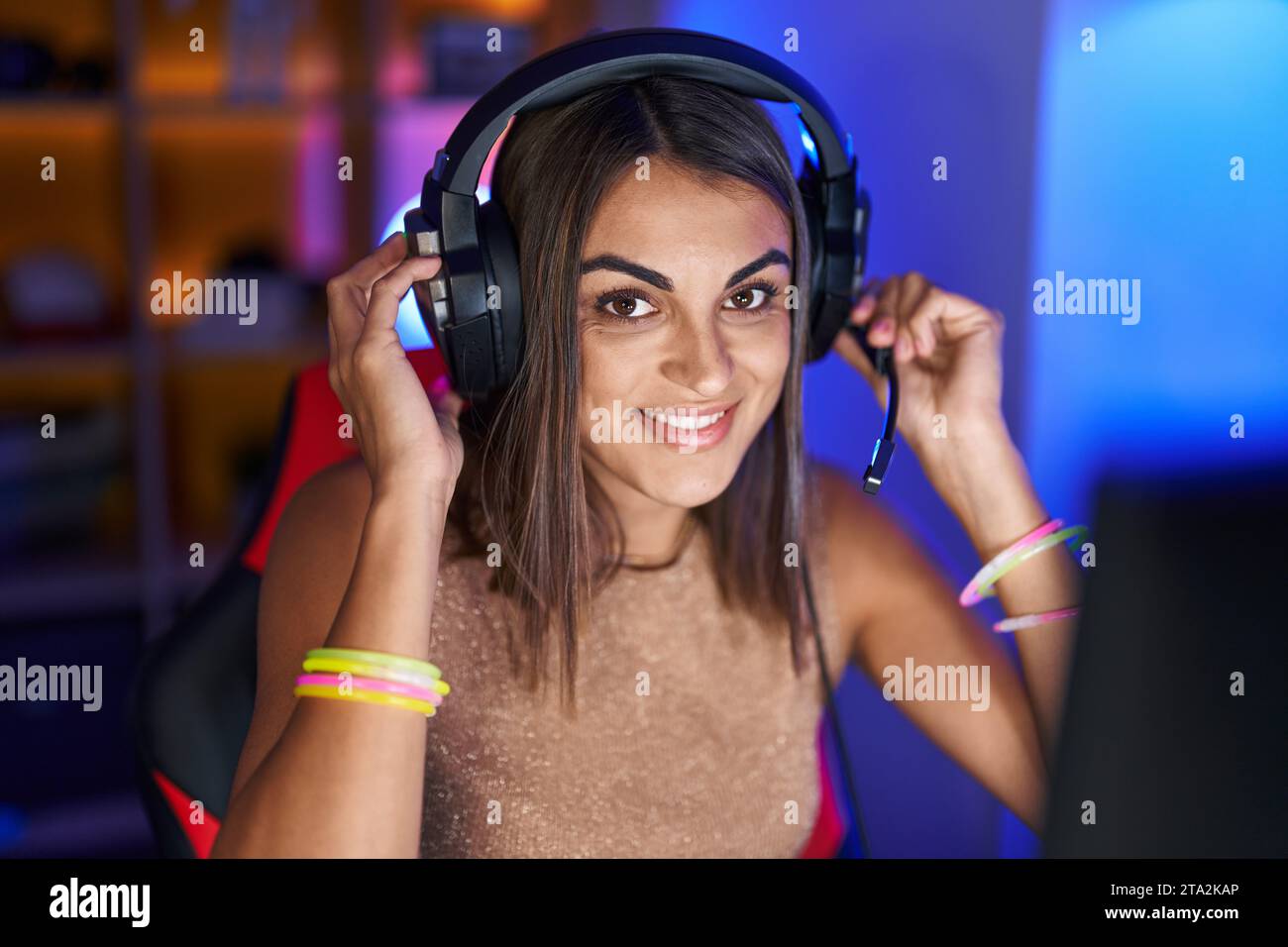 Young beautiful hispanic woman streamer smiling confident sitting on ...