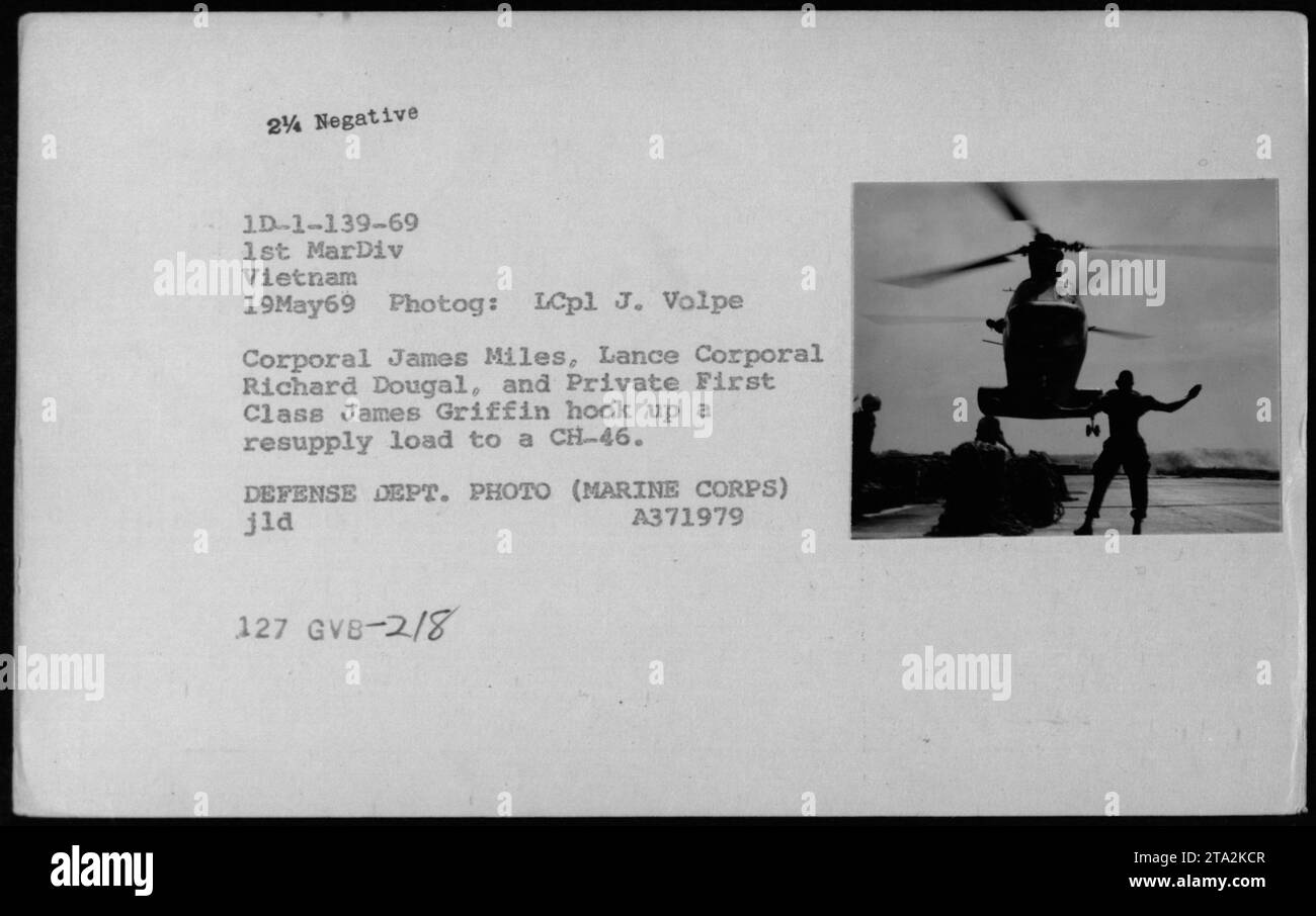 Marines from the 1st Marine Division in Vietnam load a resupply load ...