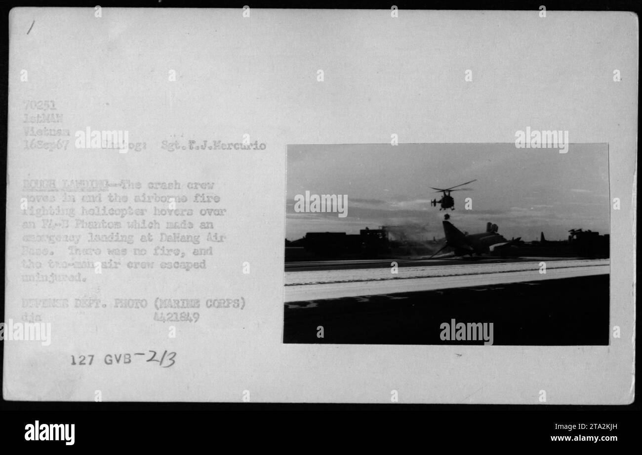 A firefighting helicopter assists in the emergency landing of an F-B ...