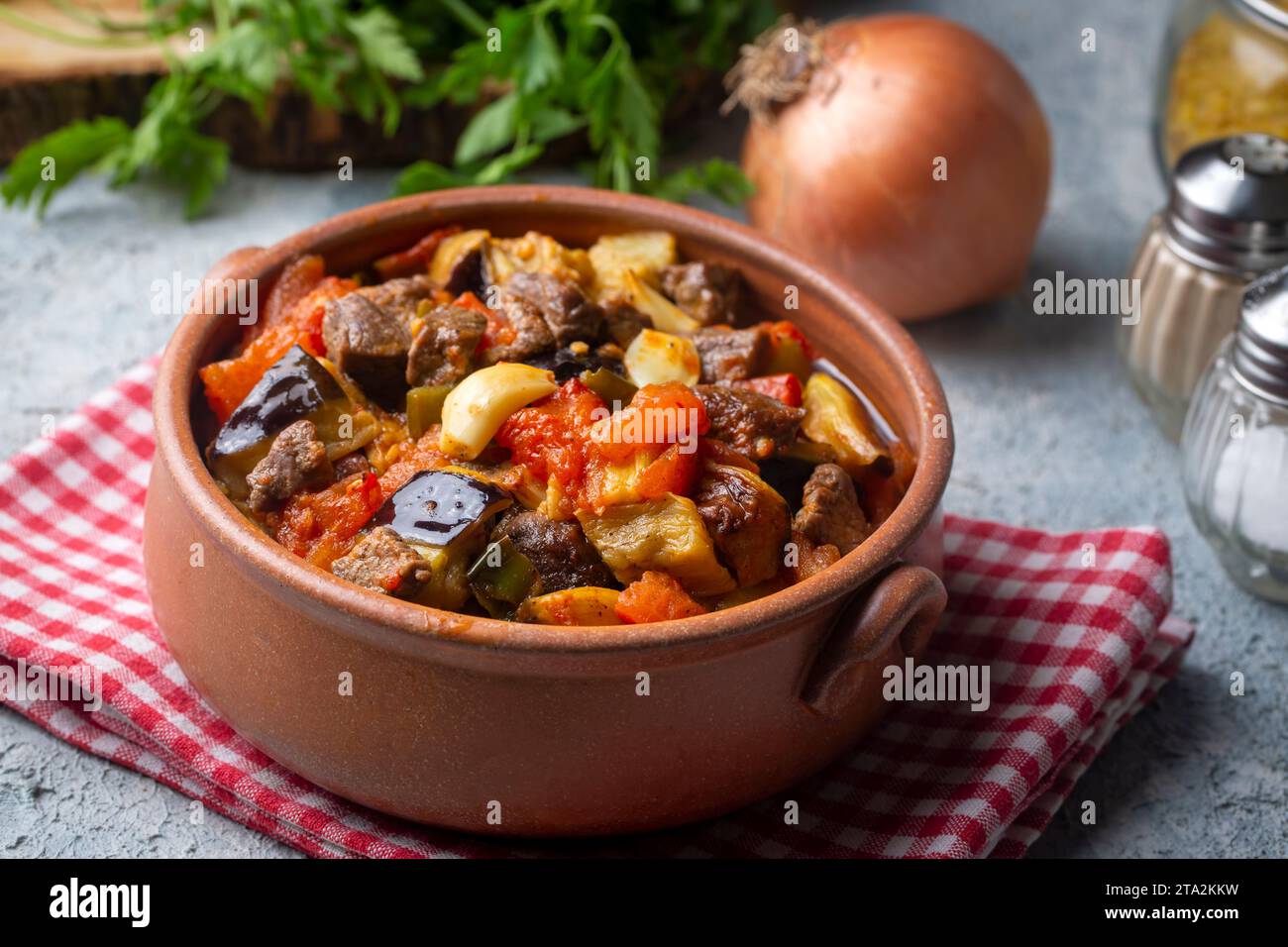 Top view of Turkish dish Guvech - baked meat with eggplant and ...