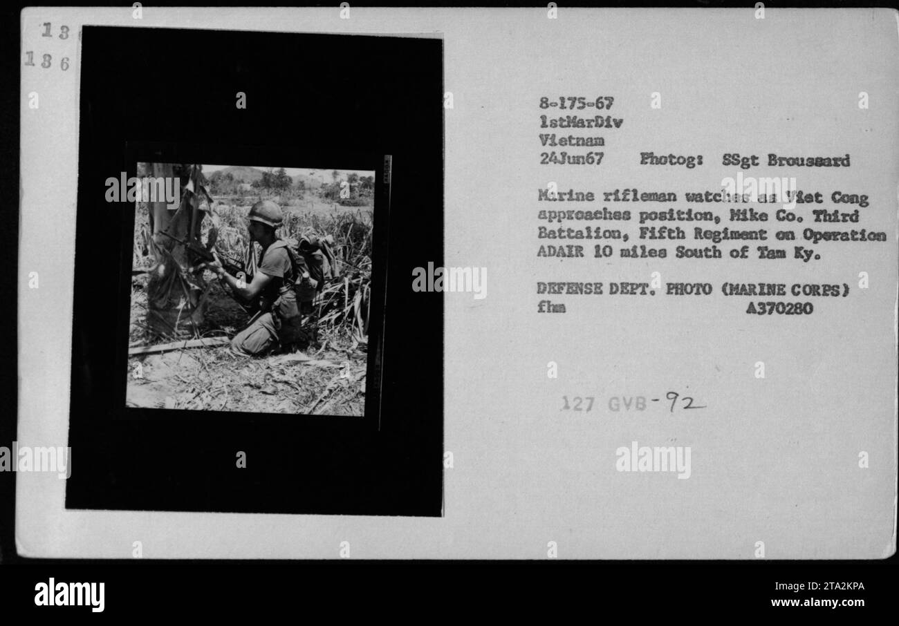 Marine rifleman keeps watch as a Viet Cong soldier approaches their ...