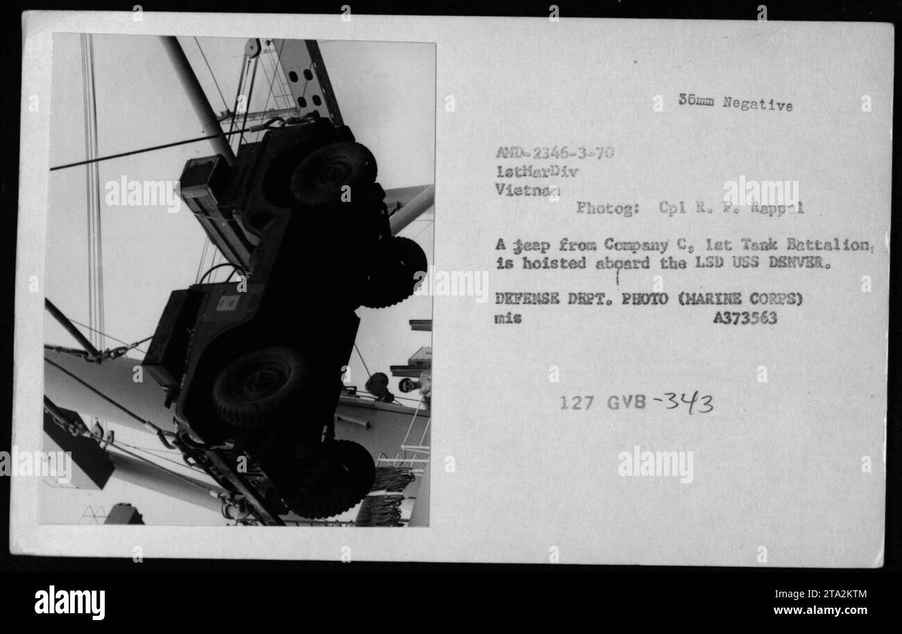 A jeep from Company C, 1st Tank Battalion, being loaded onto the USS ...