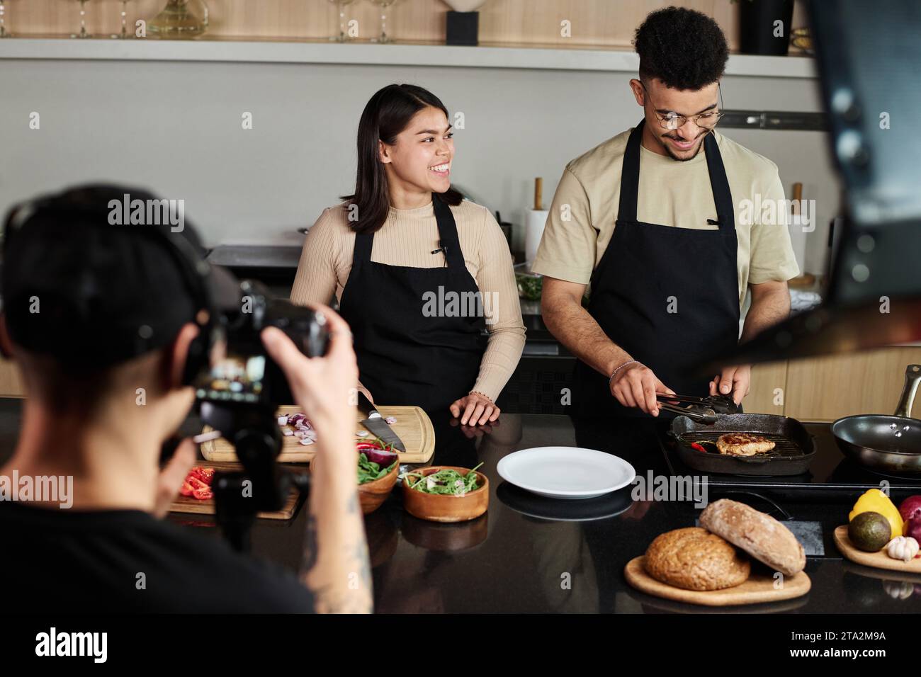High angle medium shot of young middle eastern man and hispanic woman ...
