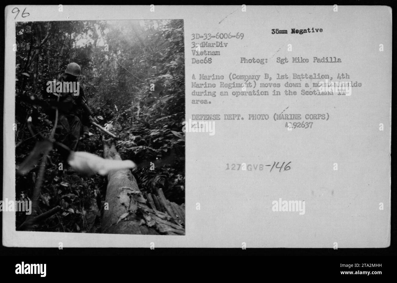 A Marine from Company B, 1st Battalion, 4th Marine Regiment, descends a ...