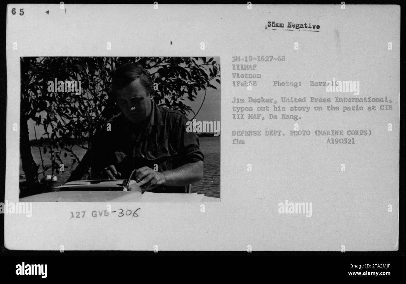 Journalist Jim Decker of United Press International types a story on ...