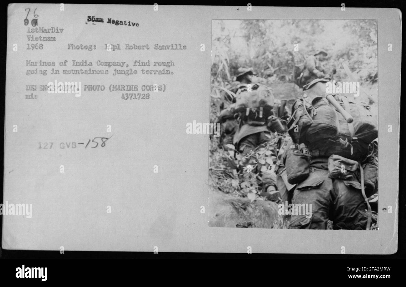 Marines from India Company maneuver through mountainous jungle terrain ...