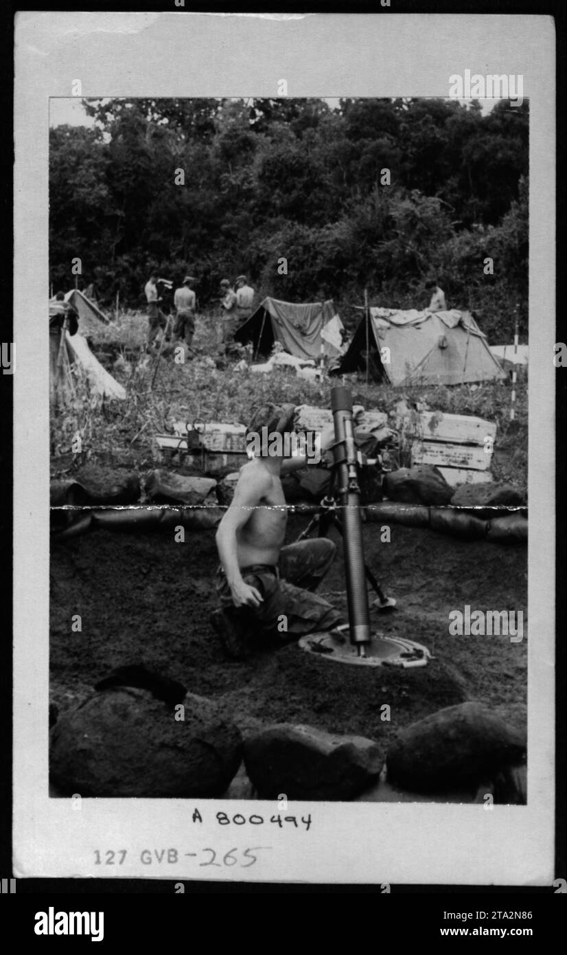 American soldiers firing mortars during the Vietnam War in 1969. The ...