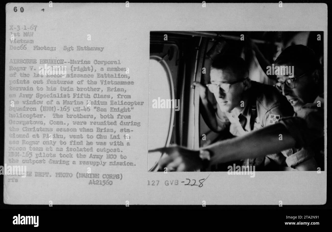 Marine Corporal Roger V.P. Burke (right), a member of the 1st ...