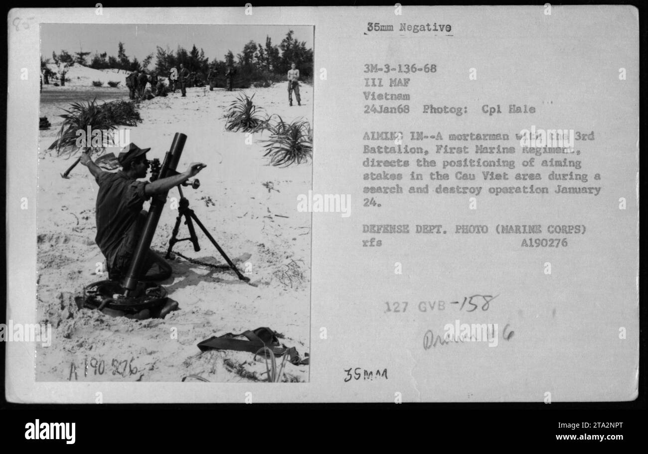 A mortarman from the 3rd Battalion, First Marine Regiment, can be seen ...