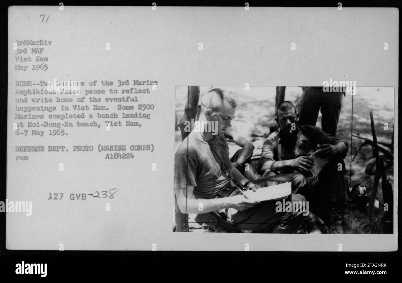 Two Marines of the 3rd Marine Amphibious Force take a moment to reflect ...