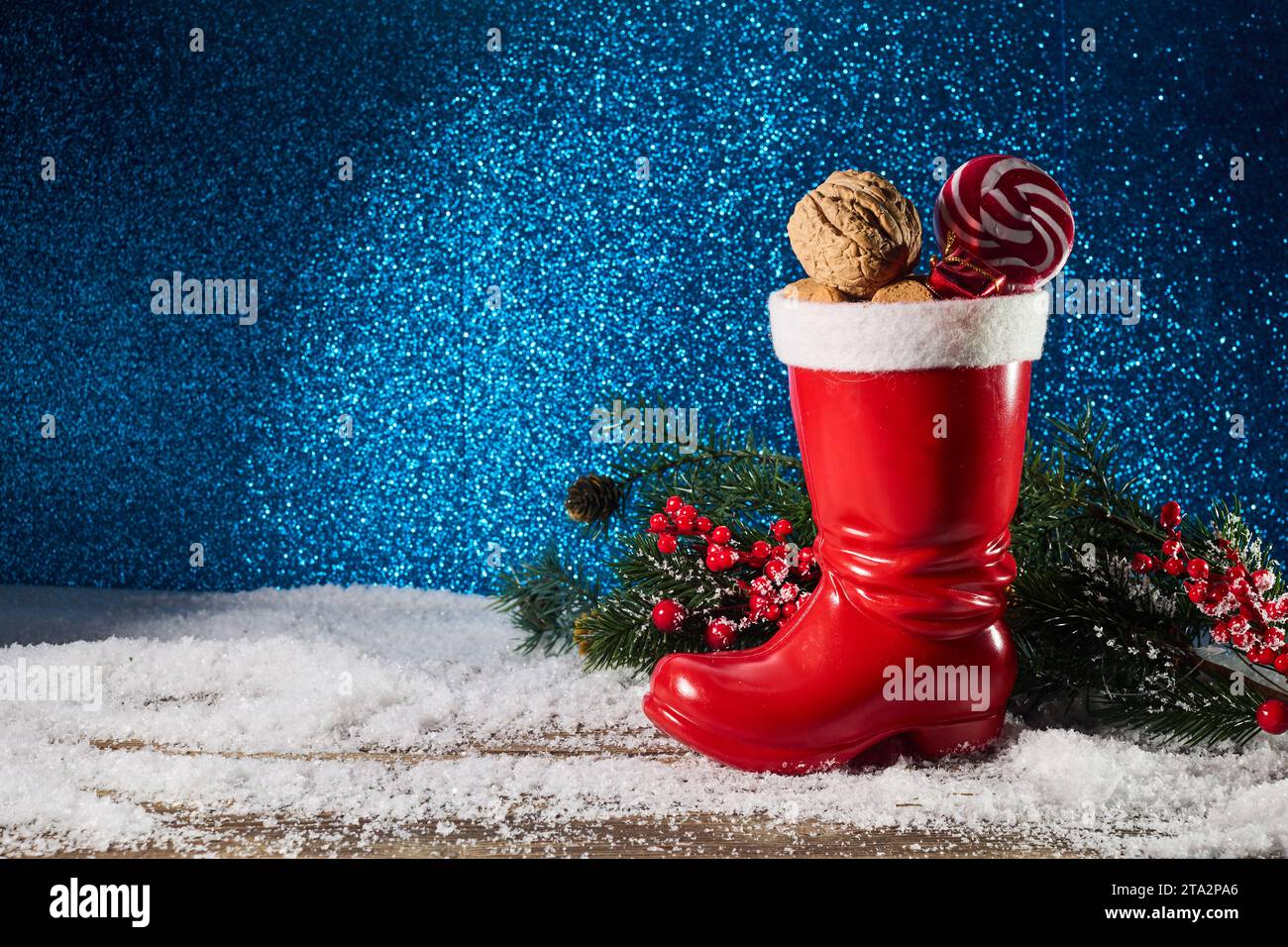 St. Nicholas Day. Red boot with sweets, spicy ginger cookies and gifts ...