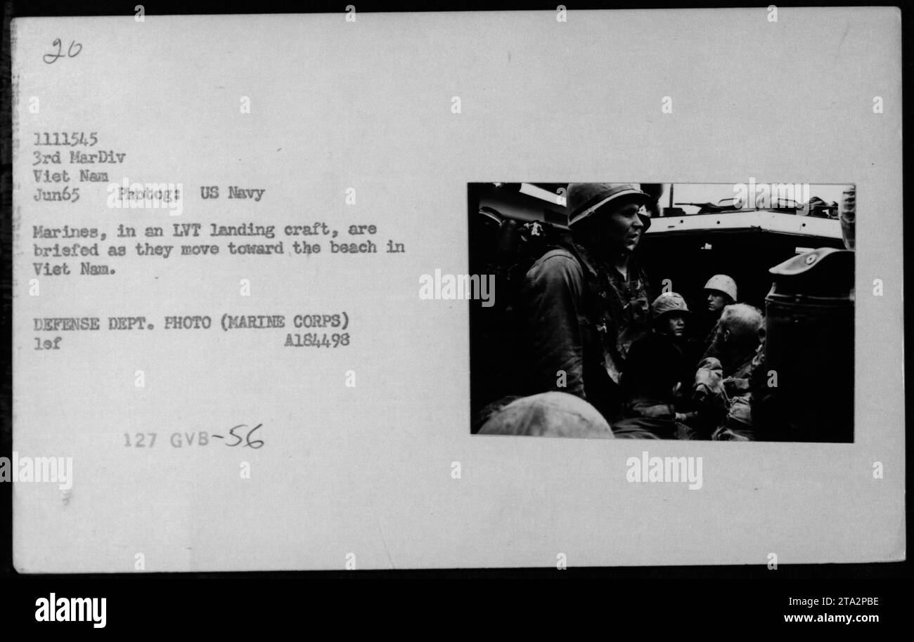 US Navy Marines of the 3rd Marine Division receive a briefing aboard an ...