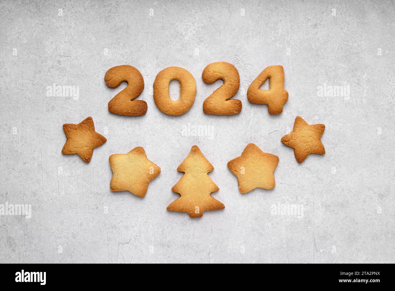 Cookies in the form of numbers 2024 in the center on the concrete ...