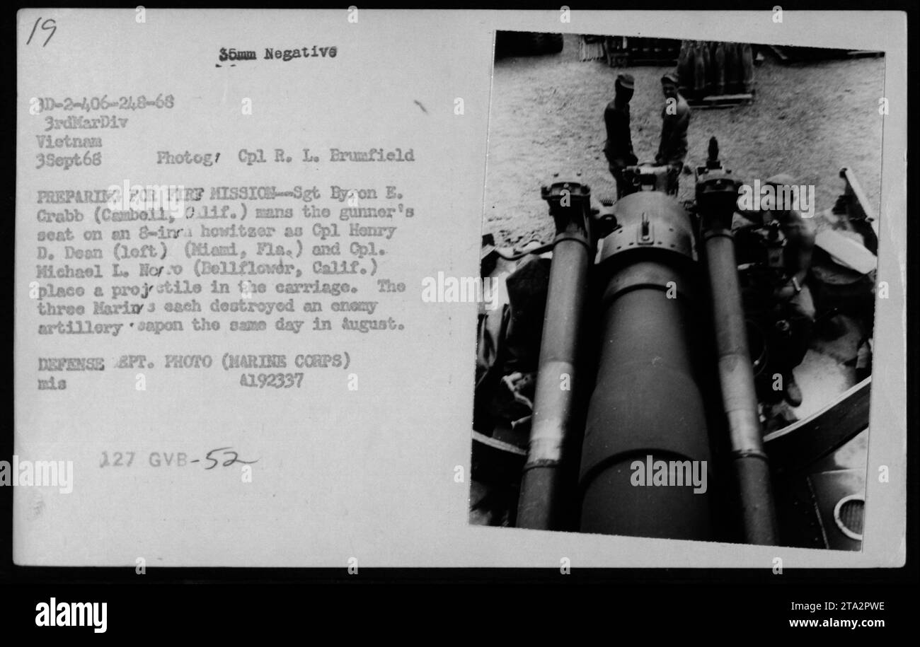 Marines from the 3rd Marine Division prepare an 8-inch howitzer for ...