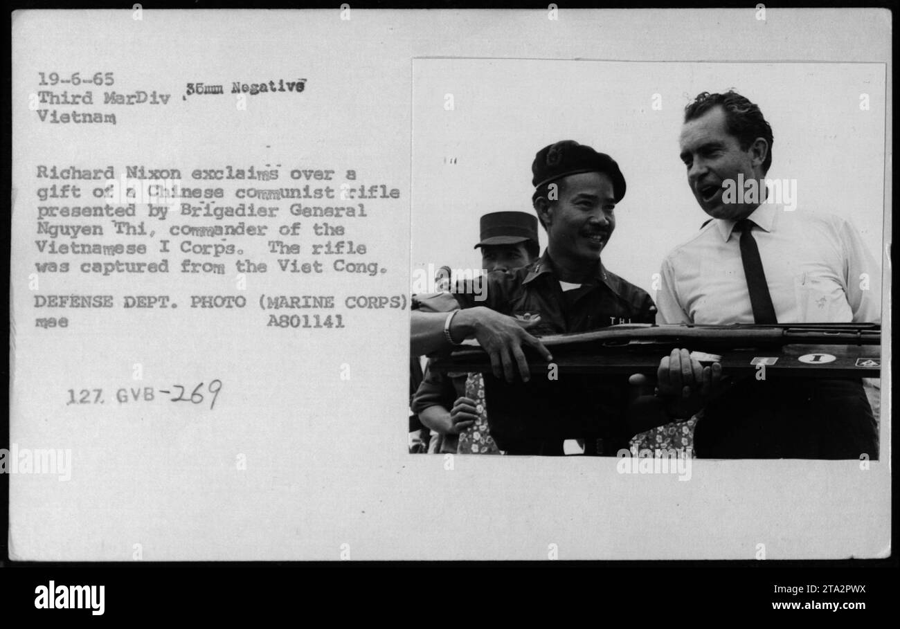Richard Nixon receives a captured Chinese communist rifle from Brig ...
