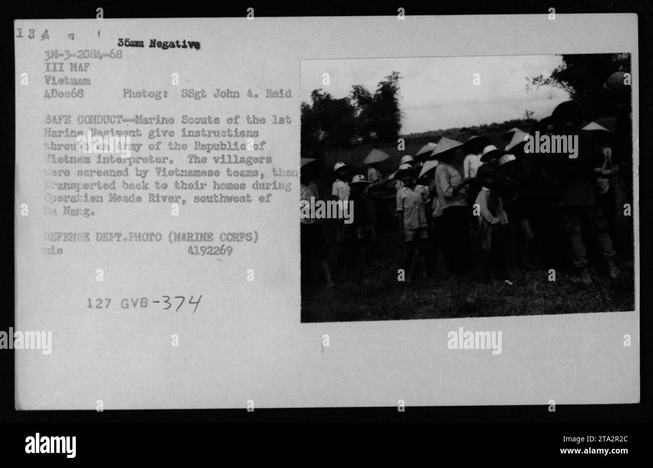 On December 4, 1968, Marine Scouts instruct Vietnamese civilians ...