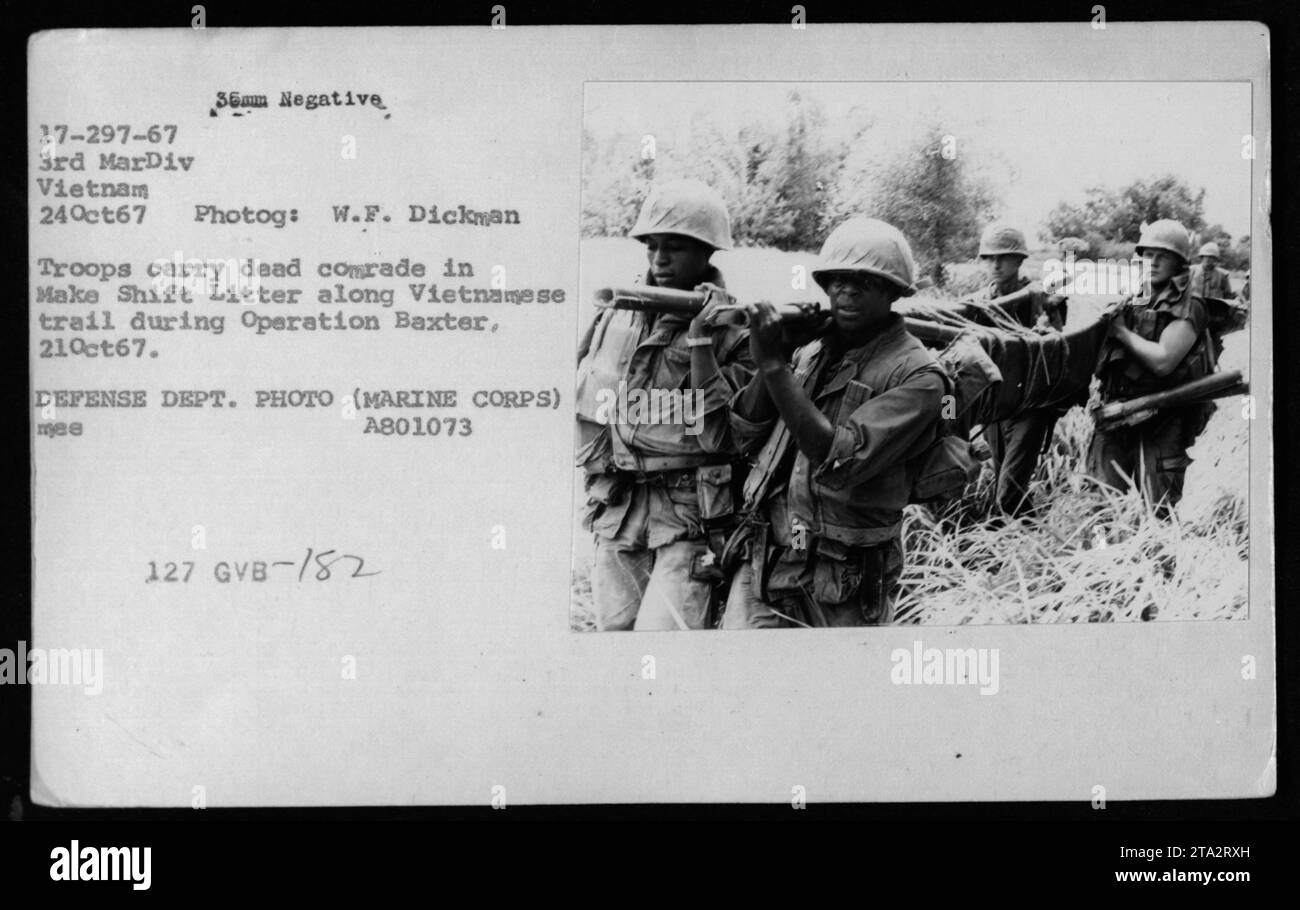 Troops carry a deceased comrade in a makeshift litter along a ...