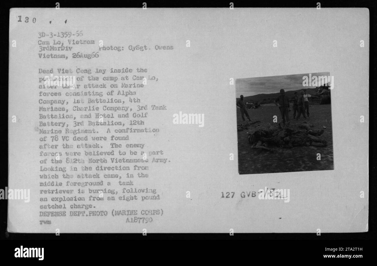 Dead Viet Cong lay inside the perimeter of the camp at Com Lo, after ...