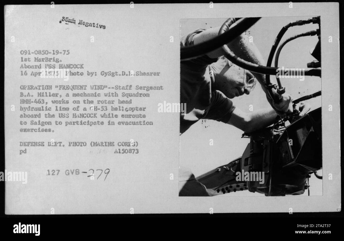 "Staff Sergeant B.A. Miller, a mechanic with Squadron HMH-463, works on ...