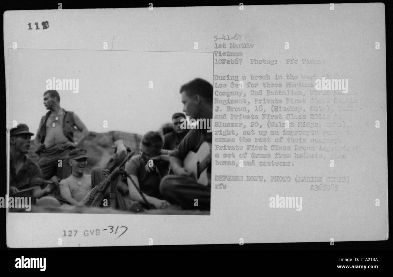 U.S. Marines, PFC Domi J. Brown and PFC Eile Slusser, take a break from their duties in Loc San ...