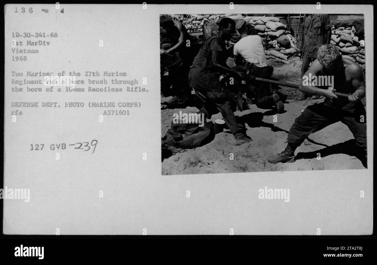 Two Marines from the 27th Marine Regiment in Vietnam, 1968, perform ...