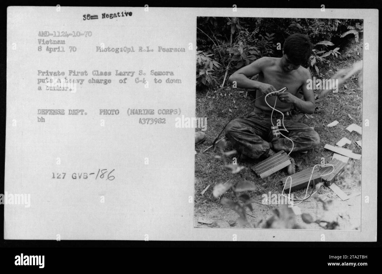 Private First Class Larry S. Semora places a C-4 charge to demolish a ...