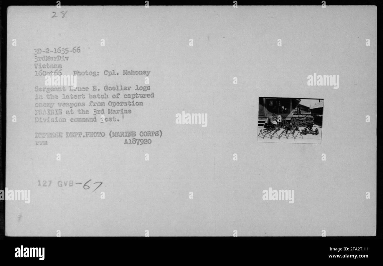 Sergeant Bruce E. Goeller is seen logging in captured enemy weapons at ...