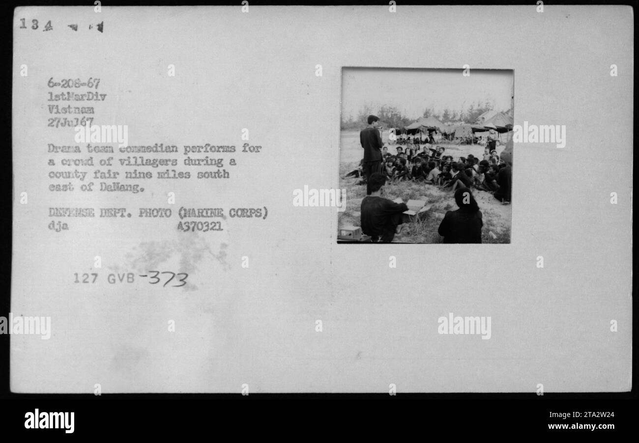 A Vietnamese comedian entertains a crowd of villagers during a county ...