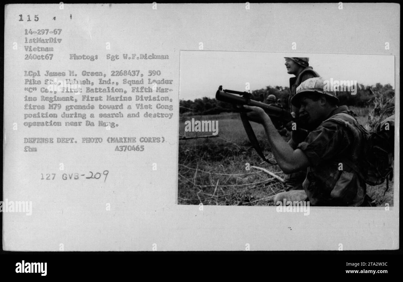 A Marine from C Company, 1st Battalion, 5th Marines, 1st Marine Division fires an M79 grenade ...