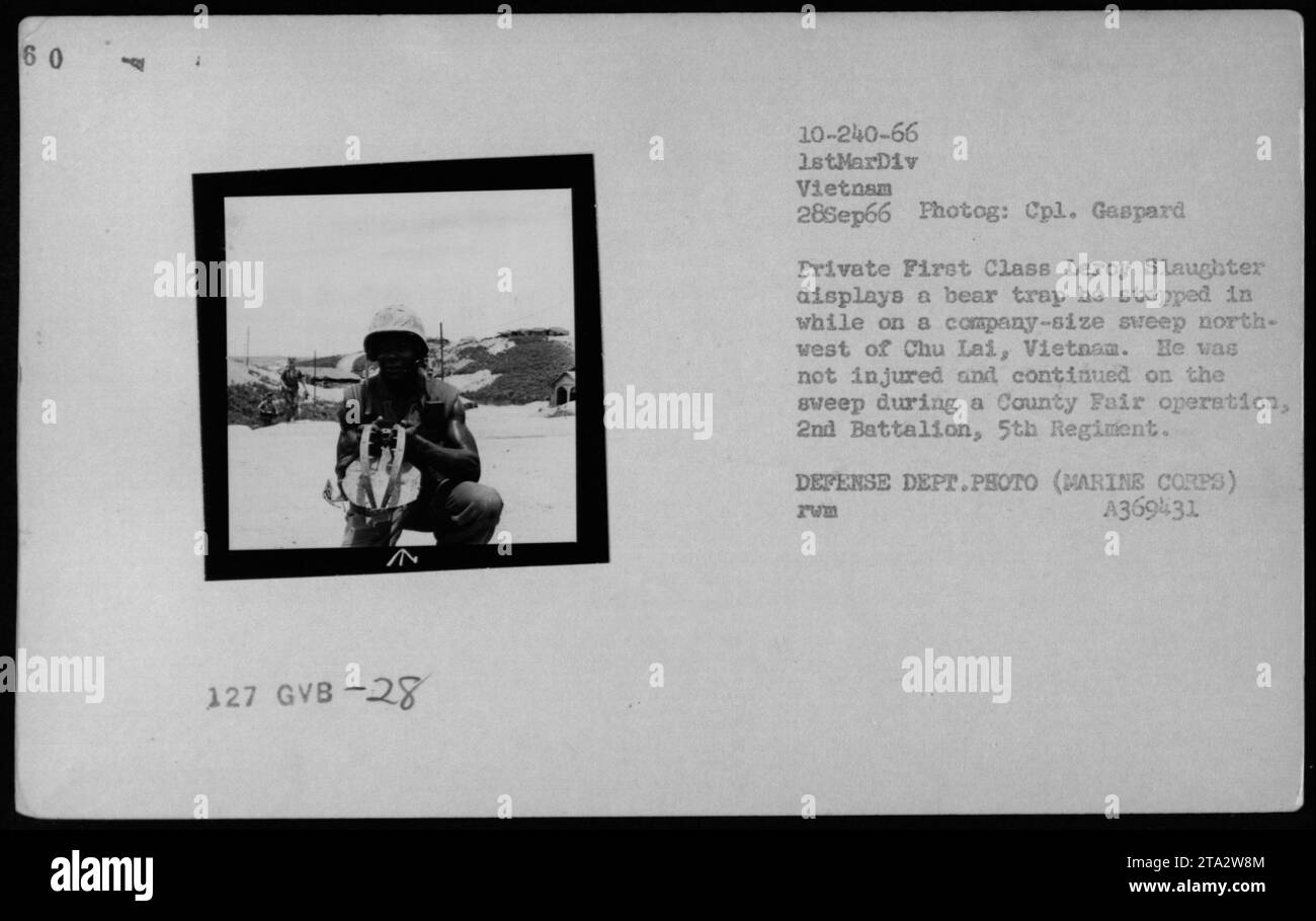 Private First Class Leroy Slaughter displays a bear trap he stepped in ...