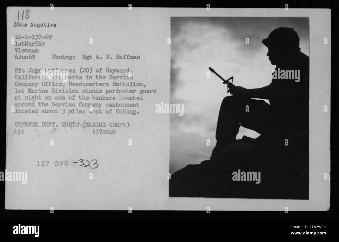 Caption: Marine Jon Gutierrez stands guard on a bunker at night in ...