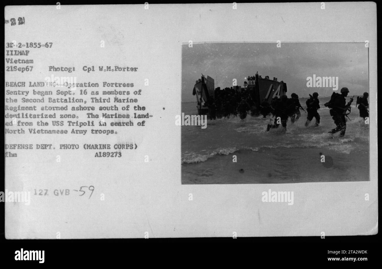 "Members of the Second Battalion, Third Marine Regiment storm ashore ...