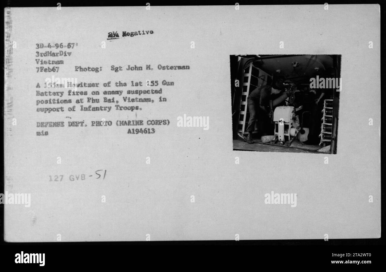 An American artillery unit fires a 155mm Howitzer at suspected enemy ...