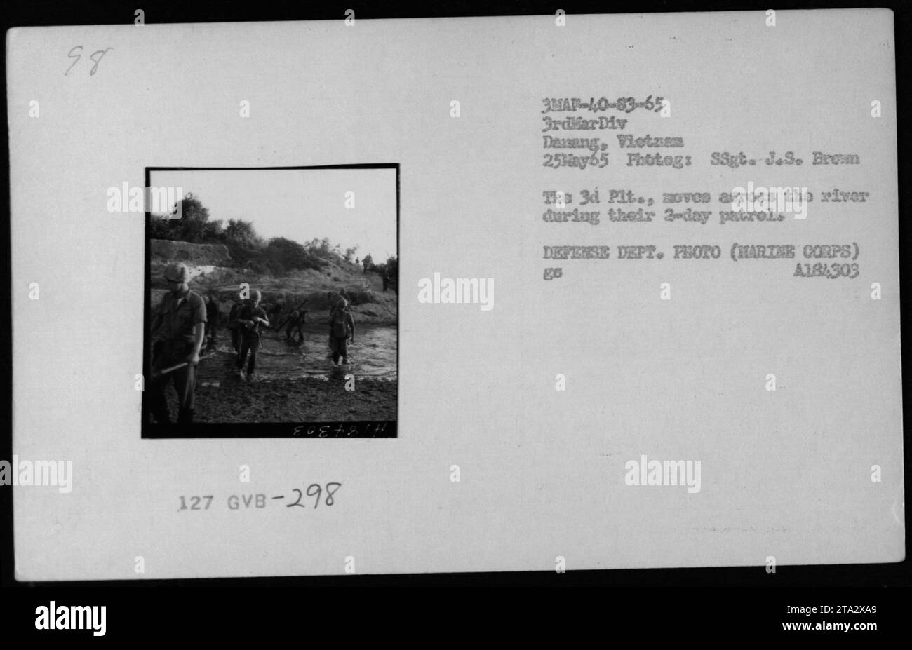 Kit Carson Scouts, reformed Viet Cong soldiers, cross a river during a ...