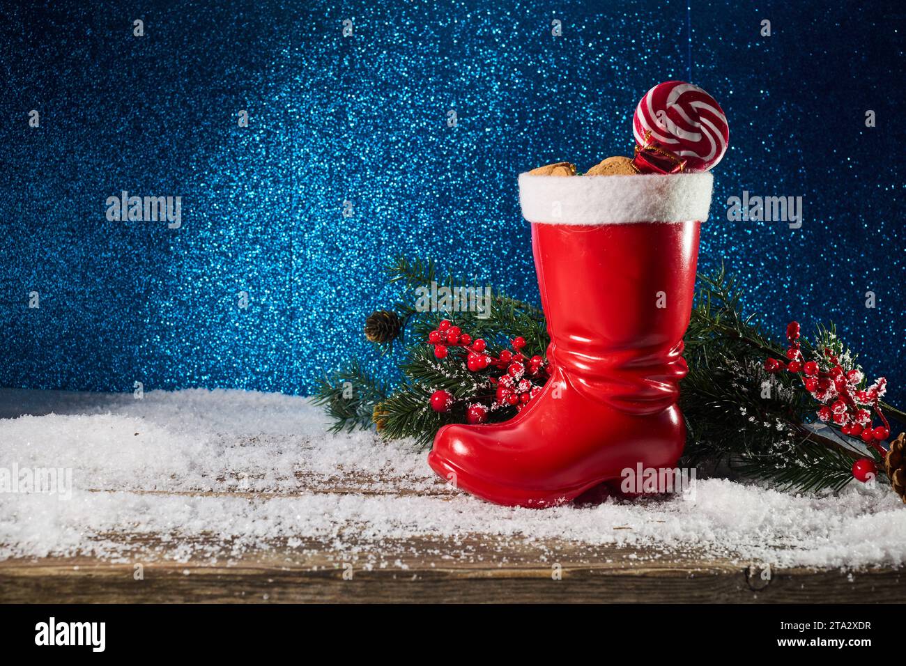 St. Nicholas Day. Red boot with sweets, spicy ginger cookies and gifts ...
